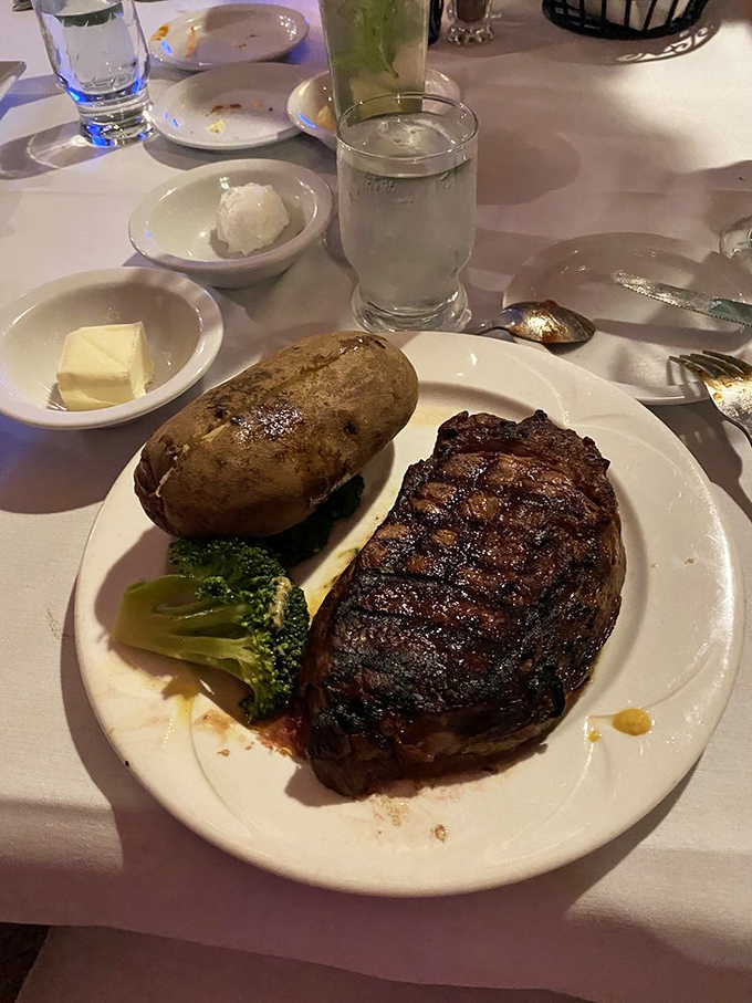 A perfectly seared ribeye with all the classic accompaniments &ndash; proof that some traditions deserve preservation in our rapidly changing culinary landscape.