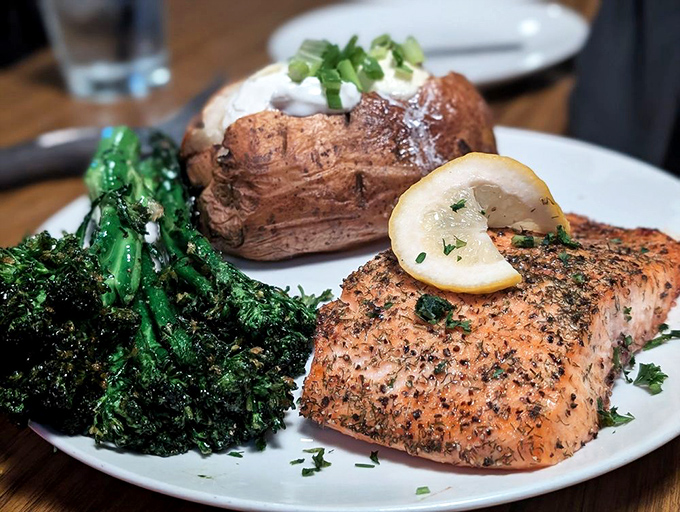 Perfectly baked salmon that flakes at the mere suggestion of your fork, accompanied by vibrant broccolini and a potato that's dressed for the occasion.