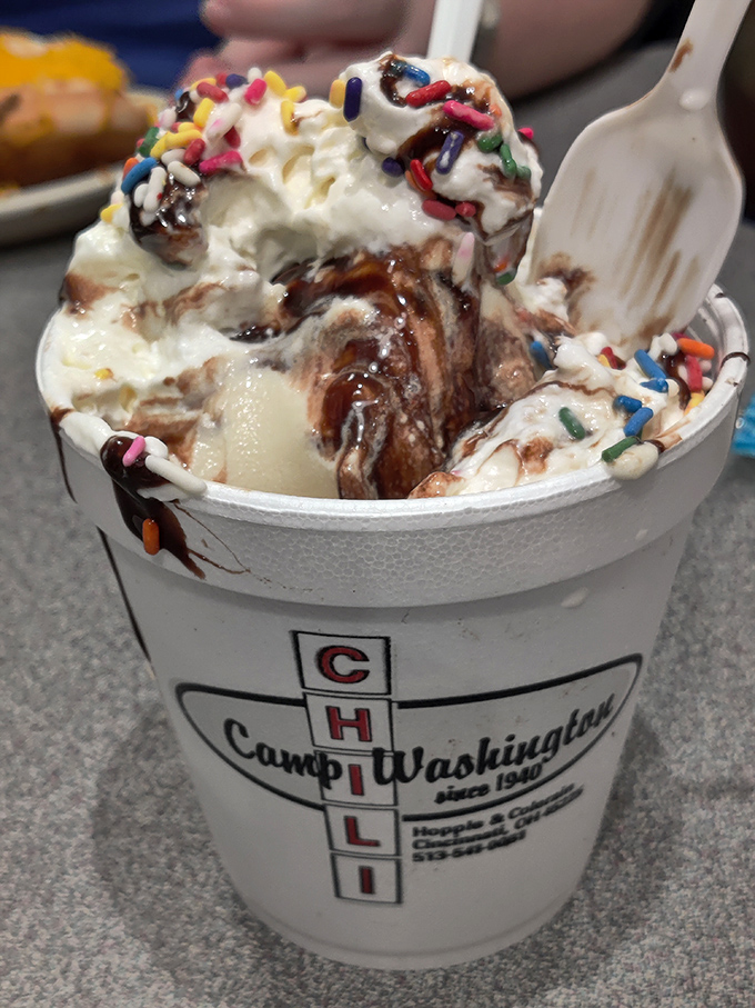 Ice cream gets the royal treatment with chocolate sauce, whipped cream, and sprinkles in a cup that proudly displays its chili heritage.