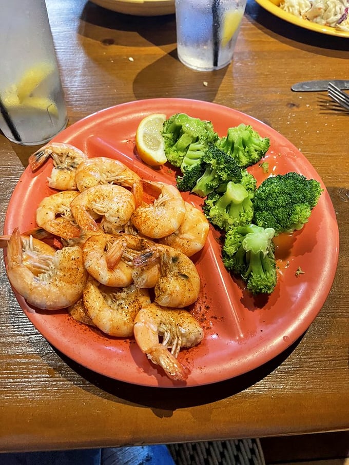 Simple, perfect shrimp with a side of broccoli for those pretending to be virtuous. The lemon wedge isn't a suggestion &ndash; it's the finishing touch.