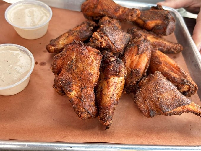 These wings didn't just get smoked; they got a PhD in flavor. The dipping sauce is just showing off at this point.