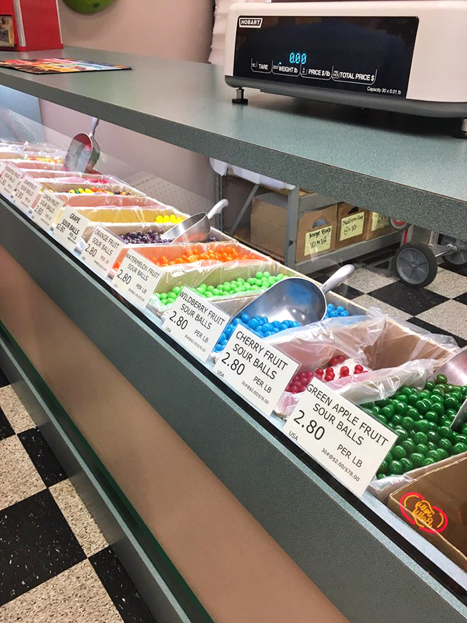 A rainbow of sour balls that promises to take your taste buds on a pucker-inducing adventure. Childhood memories sold by the scoop.