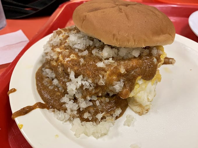 This isn't just a sandwich&mdash;it's a sundowner that brings together chili, onions, and a soft bun in perfect harmony. Napkins required, regrets impossible.