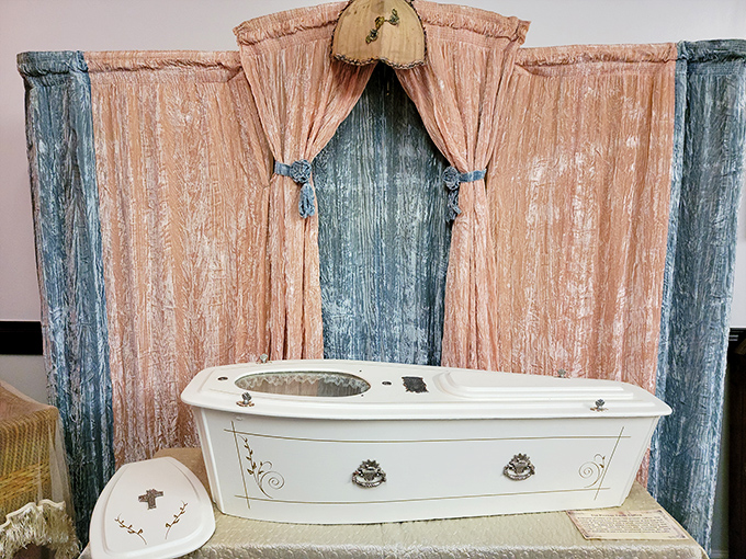 The delicate drapery and ornate details of this vintage casket showcase the Victorian belief that one's final resting place should be as elegant as their finest bedroom.