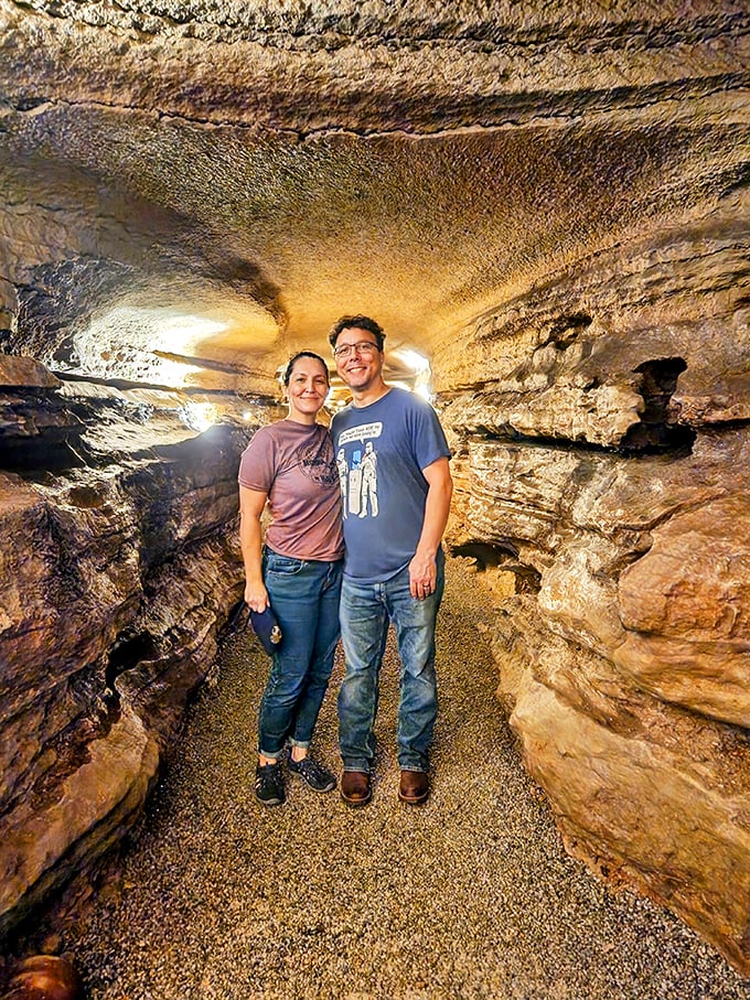 Cave explorers pause for a memory in this ancient gallery, surrounded by art that took nature thousands of years to perfect.