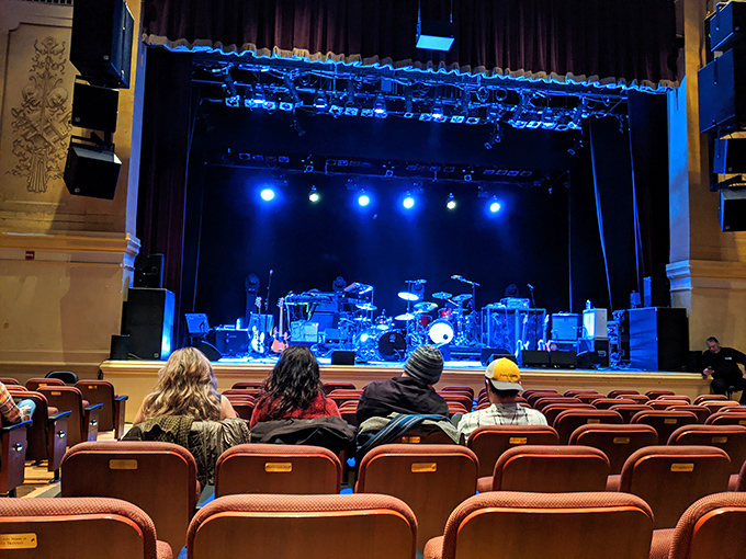 Inside the Ridgefield Playhouse, where world-class performers appear so close you can count guitar strings. No binoculars required for this intimate venue.