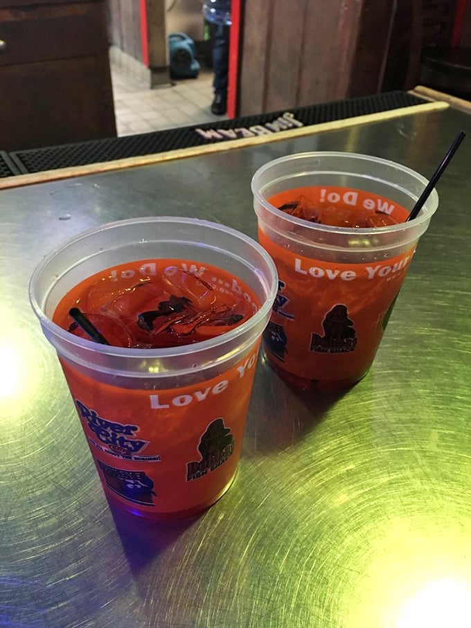 Those vibrant red cocktails aren't just drinks; they're vacation in a plastic cup, promising refreshment after a day of sun and sand.