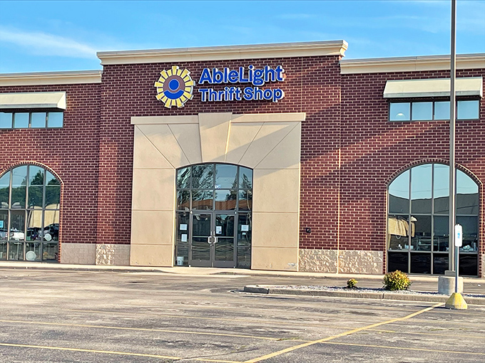 AbleLight Thrift Shop's sunny logo brightens up this brick facade. Shopping that makes both your wallet and conscience feel good!
