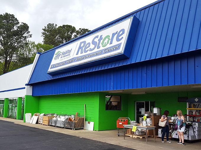 Habitat ReStore's vibrant blue and green exterior pops against the pavement. A home improvement playground for grown-ups!
