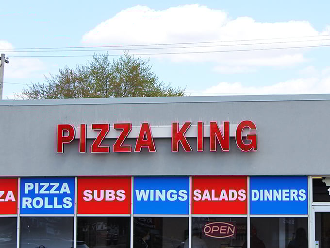 Bold colors, bold flavors! Pizza King's straightforward signage makes a simple promise they definitely keep.