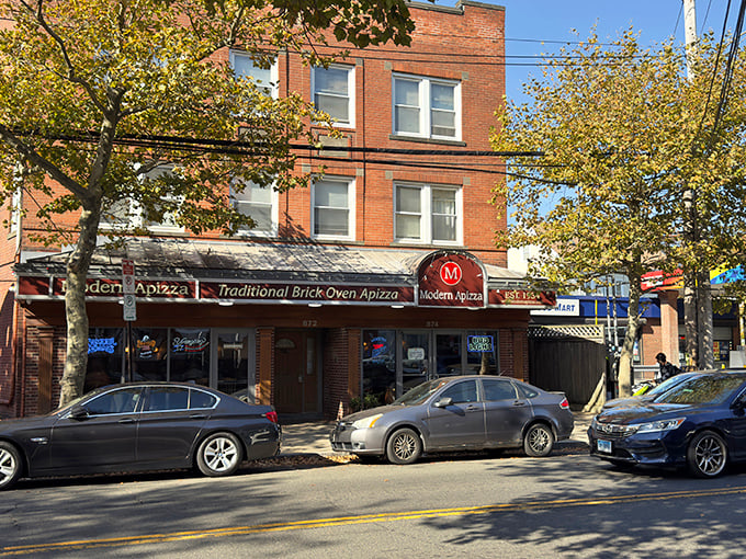 A warm afternoon at Modern Apizza invites you to enjoy a classic brick oven meal under the golden autumn trees.