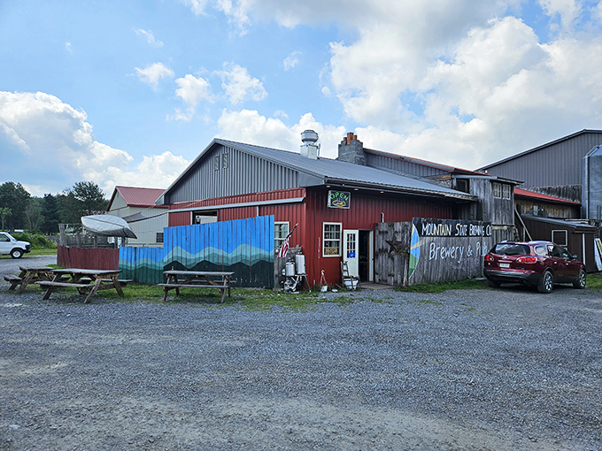 Mountain State's weathered barn exterior and colorful murals create the perfect rustic backdrop for pizza and craft beer adventures.