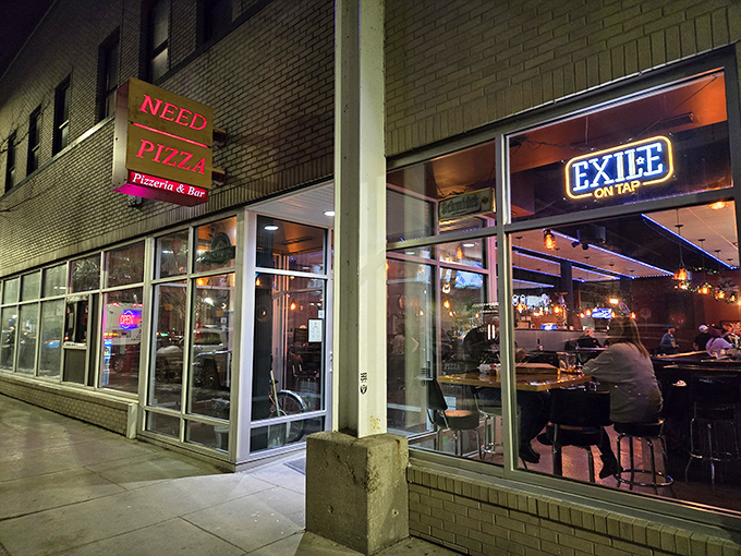 "NEED PIZZA" isn't just a sign &ndash; it's the universal truth glowing in the Cedar Rapids night.