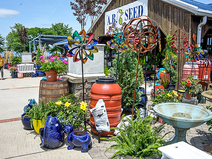 Garden art and blooming beauties greet visitors outside the Piedmont Triad Market. Nature's color palette on full display!