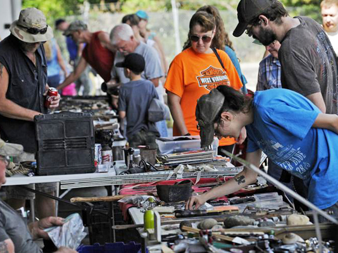 Treasure hunting headquarters! Crowds gather around tables where ordinary objects transform into must-have finds through the magic of discovery.