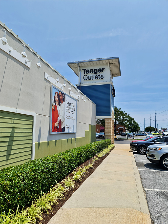 Tanger Outlets' distinctive blue tower rises above the shopping paradise &ndash; your wallet may be lighter, but your bags won't be!