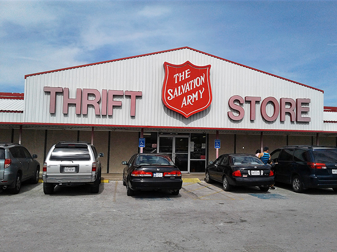 The Salvation Army's iconic shield stands guard over a warehouse of possibilities. White walls, red logo, endless treasures.