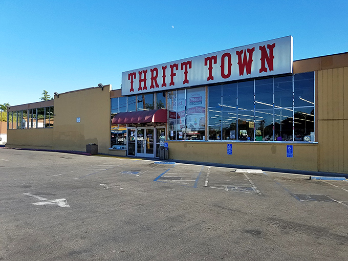 Thrift Town's bold red lettering promises a wonderland of affordable discoveries waiting just beyond those front doors.