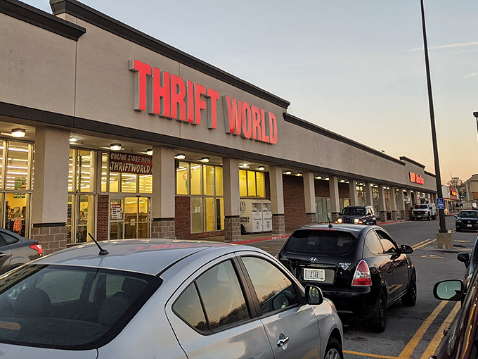 Thrift World's bold red letters glow against the evening sky. A universe of bargains awaits inside!