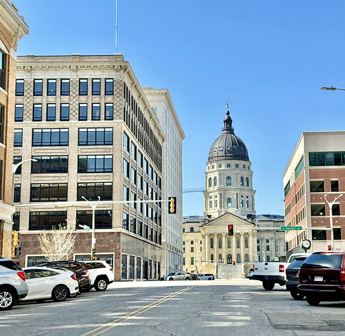 Topeka's capitol dome peeks between modern buildings, a reminder that history and progress stand side by side in Kansas's capital.