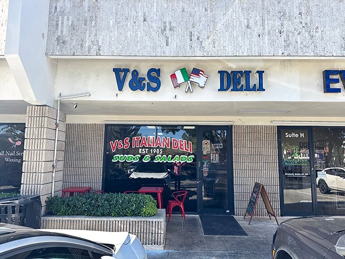 V&S Italian Deli's facade brings a slice of Italy to Boca Raton &ndash; those red tables have witnessed countless sandwich love affairs.