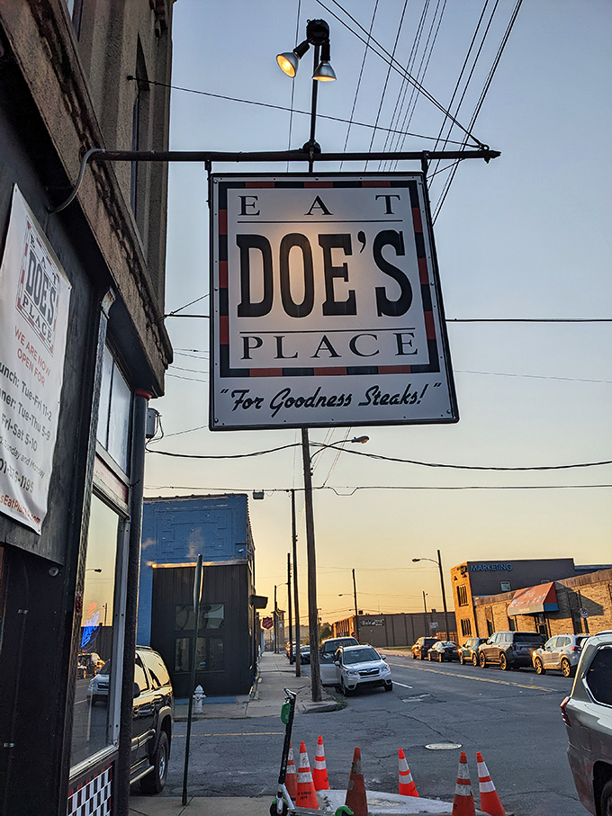 The iconic Doe's sign glows against the evening sky &ndash; a beacon for those seeking legendary porterhouse perfection.