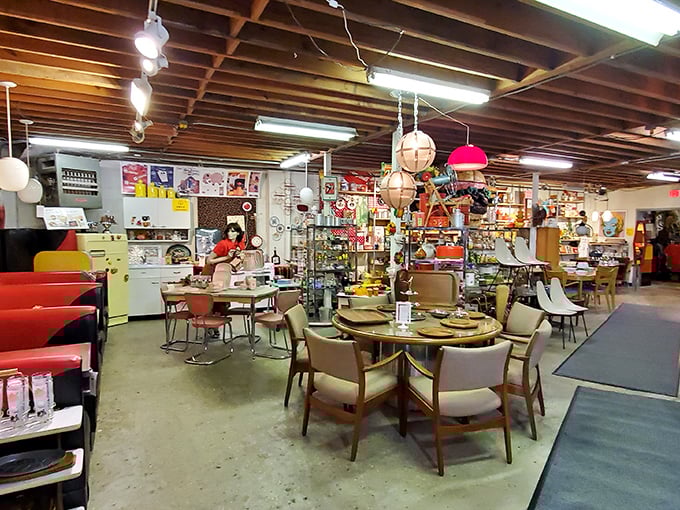 Vintage furniture arranged like a 1960s living room catalog &ndash; Flower Child knows how to set a retro scene.