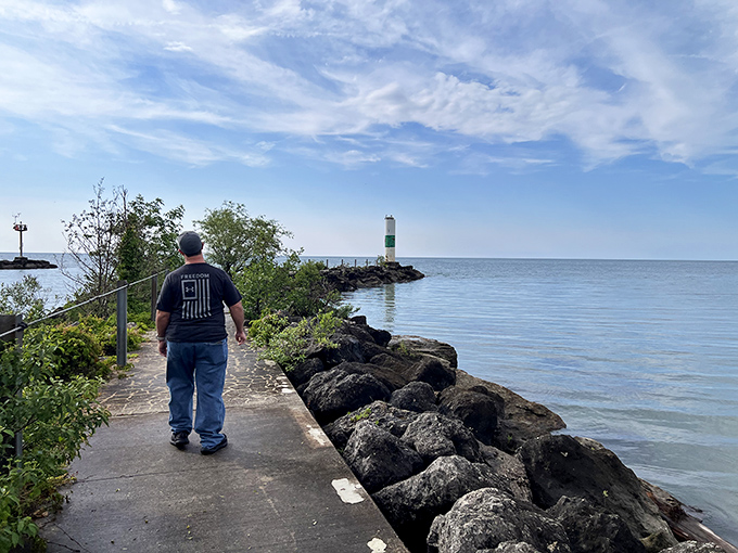 Geneva State Park: "Lighthouse in the distance. Some walks aren't about the steps&mdash;they're about the horizon that keeps pulling you forward."