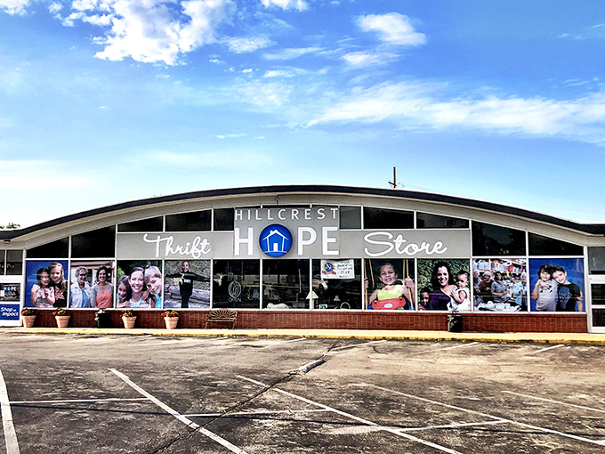 The Hope Store's window displays showcase community stories. Each photo represents lives touched by this thrifting mission.