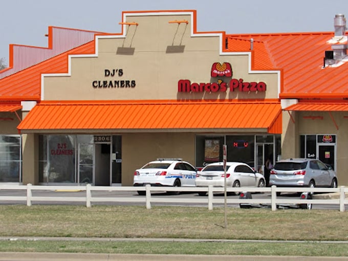 Marco's unassuming storefront sits between everyday errands. The best pizza often hides in plain sight, waiting for those who know.