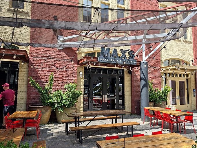 Those red chairs aren't just for sitting&mdash;they're front-row seats to the smoky, charred perfection that only comes from coal-fired ovens.