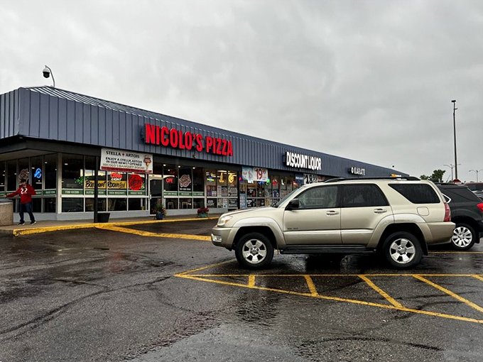 That blue awning might be understated, but what happens to pizza inside this place is anything but.