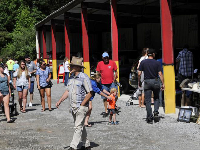 Country market charm! Red pillars frame the entrance to a world where haggling is still an art form and every purchase has a story.