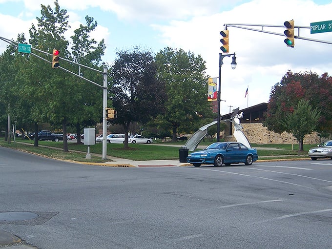 The Redmond Theater's neon sign glows against the evening sky, a beacon of entertainment in downtown Terre Haute.