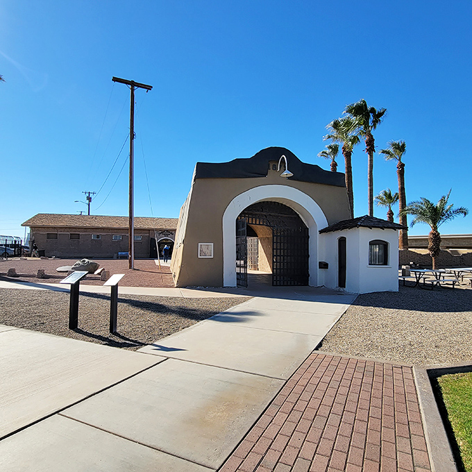 The prison's imposing entrance gate still looks ready to clang shut behind unfortunate souls sentenced to "the hell hole" of the Southwest.