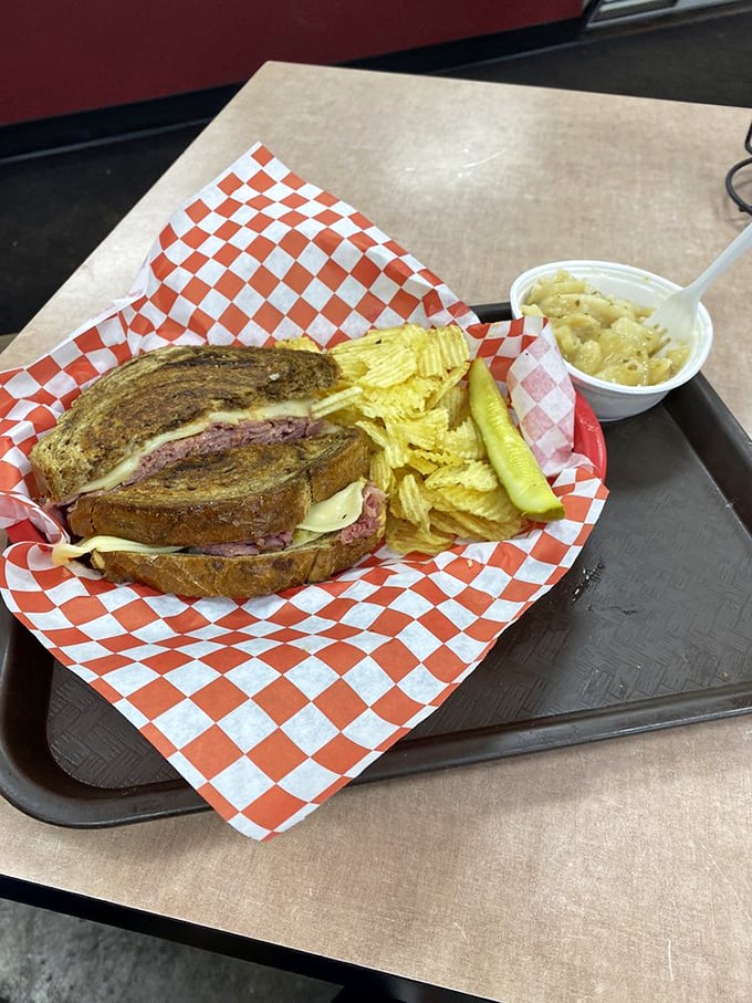 That Russian dressing oozing from the edges promises the perfect tangy complement to the rich corned beef. Napkins required, regrets forbidden. 