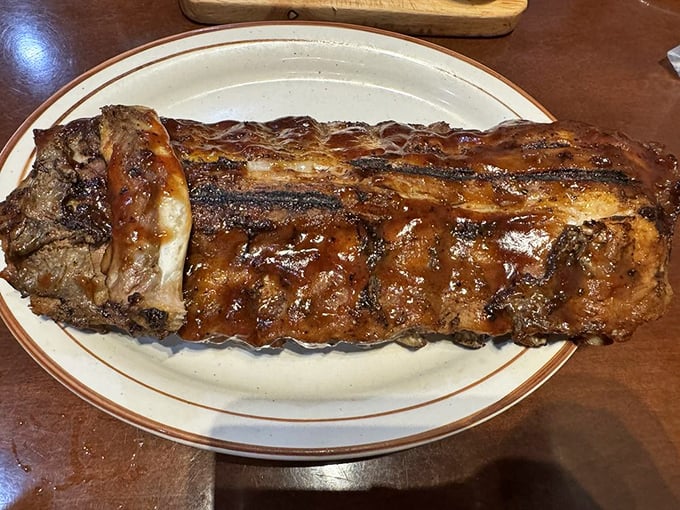 Ribs that make you reconsider your table manners. When meat falls off the bone like this, napkins become essential accessories.