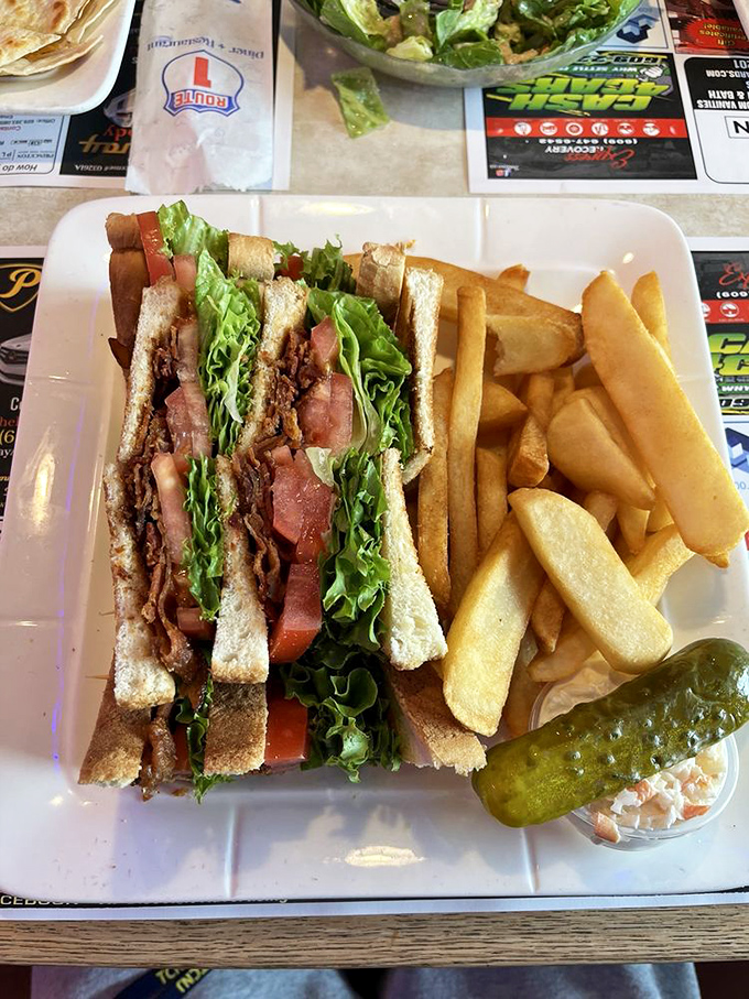 Architecture in sandwich form. The BLT stands tall with crisp lettuce, ripe tomato, and bacon in perfect harmony &ndash; the skyscraper of lunch options.