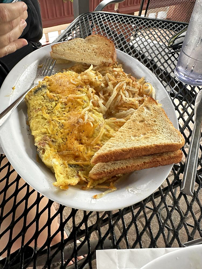 This isn't just an omelet&mdash;it's a morning masterpiece where eggs, cheese, and perfectly crisped hash browns perform a harmonious breakfast ballet.