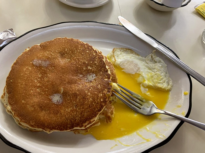 Golden pancakes with that perfect crisp edge, alongside sunny-side-up eggs. Breakfast doesn't get more honest than this.