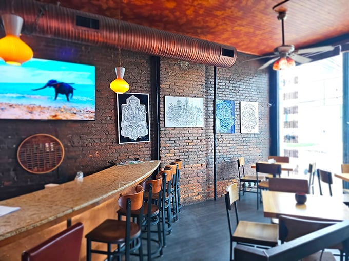 The bar area whispers "stay awhile" with exposed brick, pendant lighting, and enough character to star in its own HBO series. 