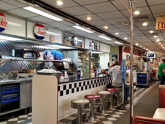 The open kitchen concept was cool before it was cool. Watch short-order magic happen while perched on these iconic chrome and vinyl stools.