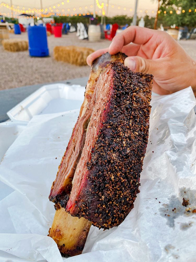 The beef rib—barbecue's version of a mic drop. This isn't just meat on a bone; it's a prehistoric-looking testament to smoke mastery.