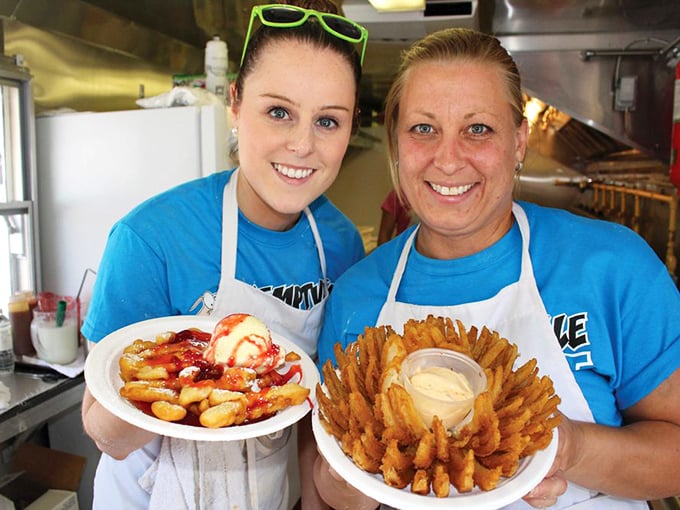 Fair food nirvana: golden spiral-cut potatoes and strawberry-topped funnel cake. Diet plans come here to die a deliciously happy death.