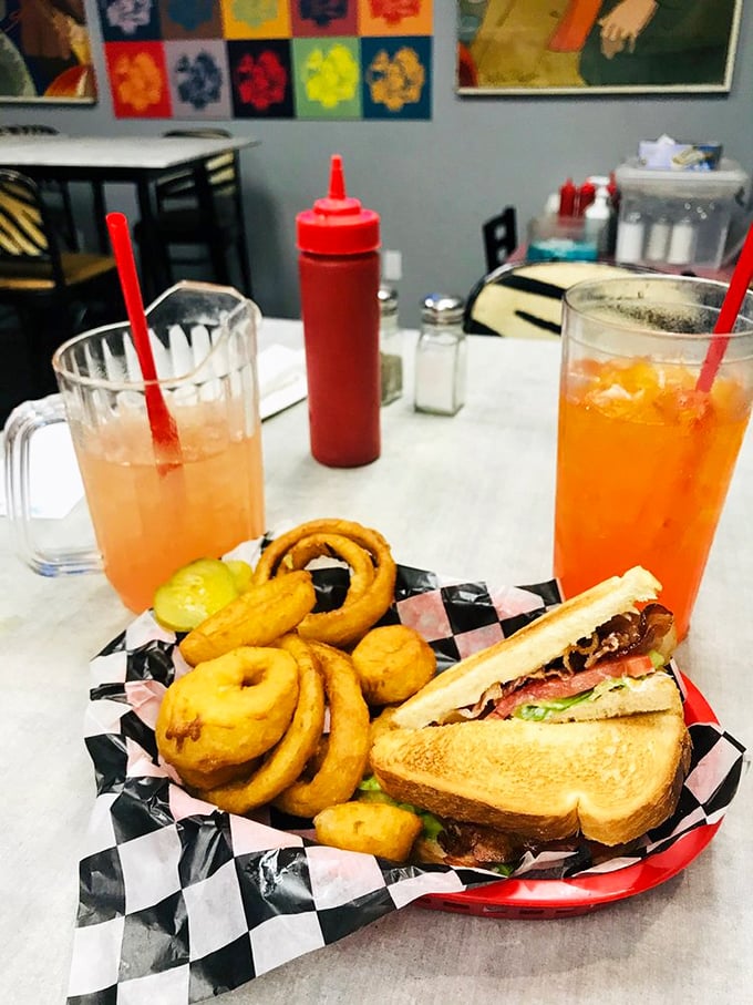 BLT with onion rings and colorful drinks&mdash;proof that lunch can be both nostalgic and exciting. That checkered paper says "trust me, I'm delicious."