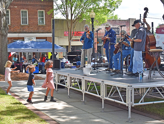 These bluegrass musicians aren't just playing songs&mdash;they're keeping traditions alive while kids dance with the kind of freedom only small-town festivals allow.