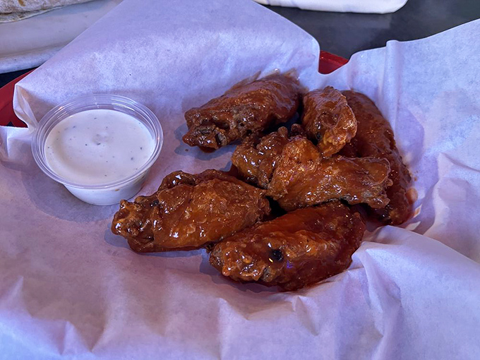 Buffalo wings that strike that magical balance—saucy enough to require napkins, meaty enough to make the mess worthwhile.