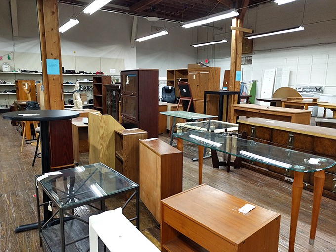 A forest of wooden furniture stands at attention, from mid-century modern coffee tables to sturdy bookshelves ready for their second act.