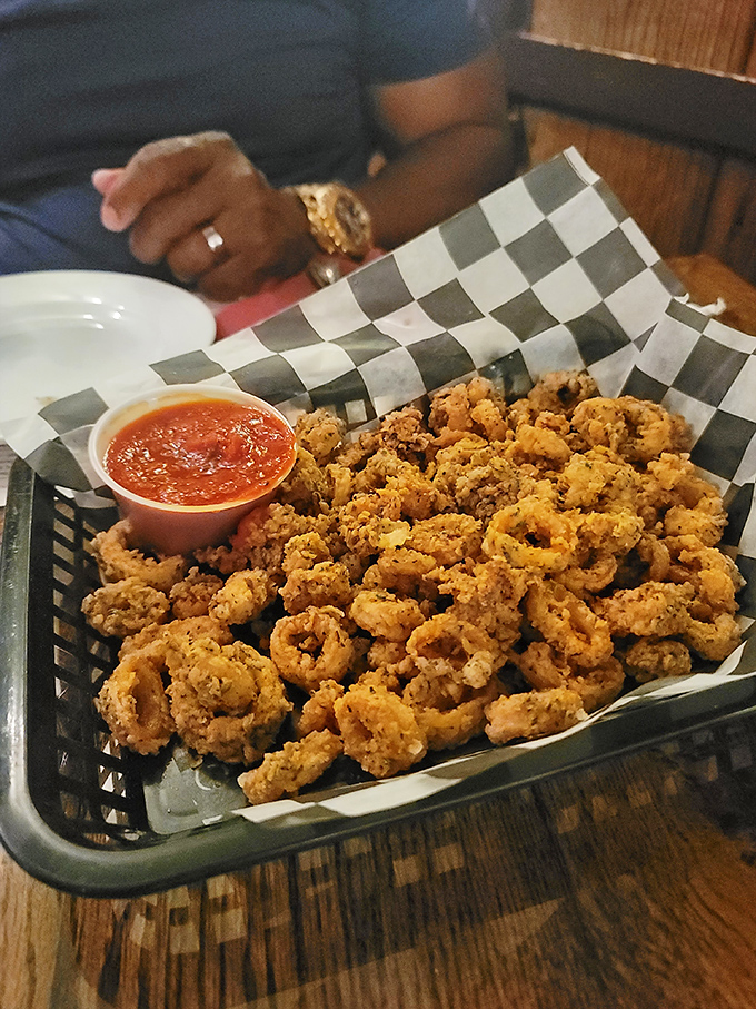 Crispy calamari that shatters with each bite, served unpretentiously in a basket with marinara that's begging to meet these golden rings of joy.