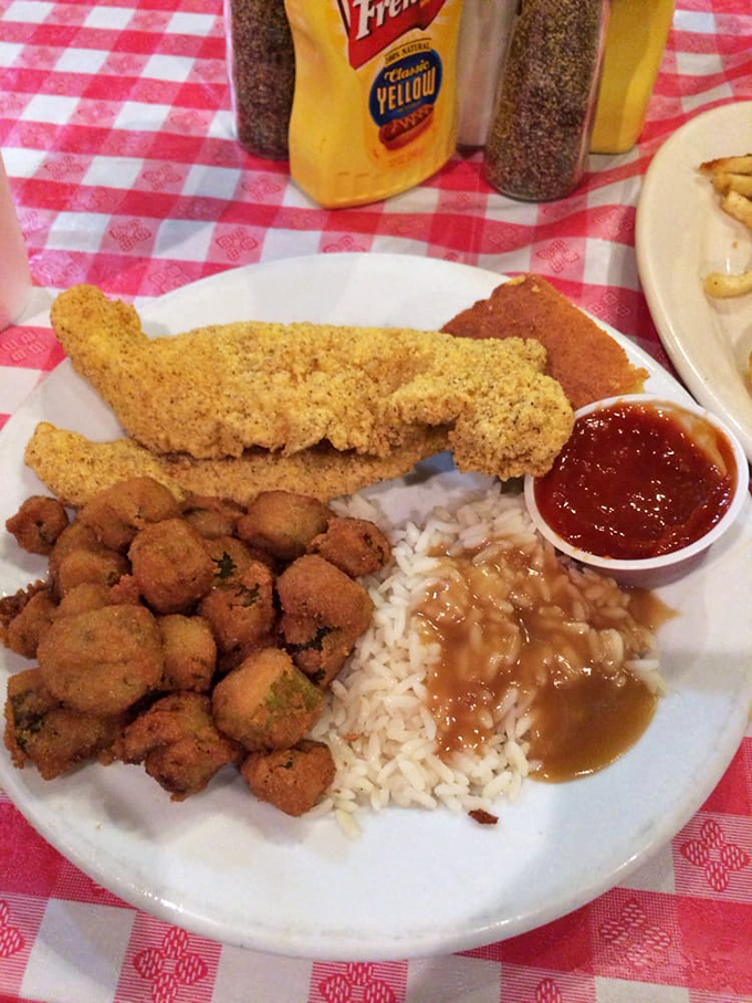 Southern cuisine in full glory: crispy catfish, fried okra, and rice with beans. Calories don't count when the food makes you this happy.
